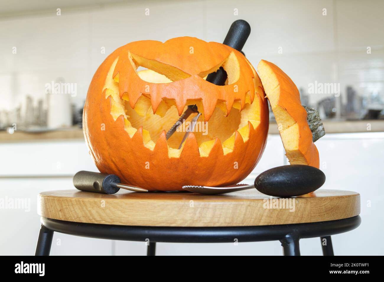 Carved Halloween pumpkin, Jack Lantern and carving tools. Spooky Jack-o ...