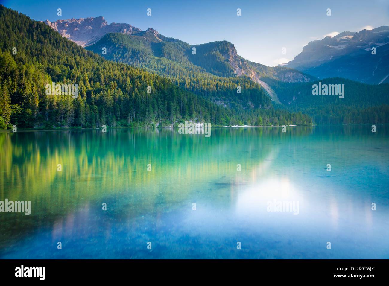 Lake Tovel reflection symmetry in Trentino-Alto Adige, Dolomites, Italy ...
