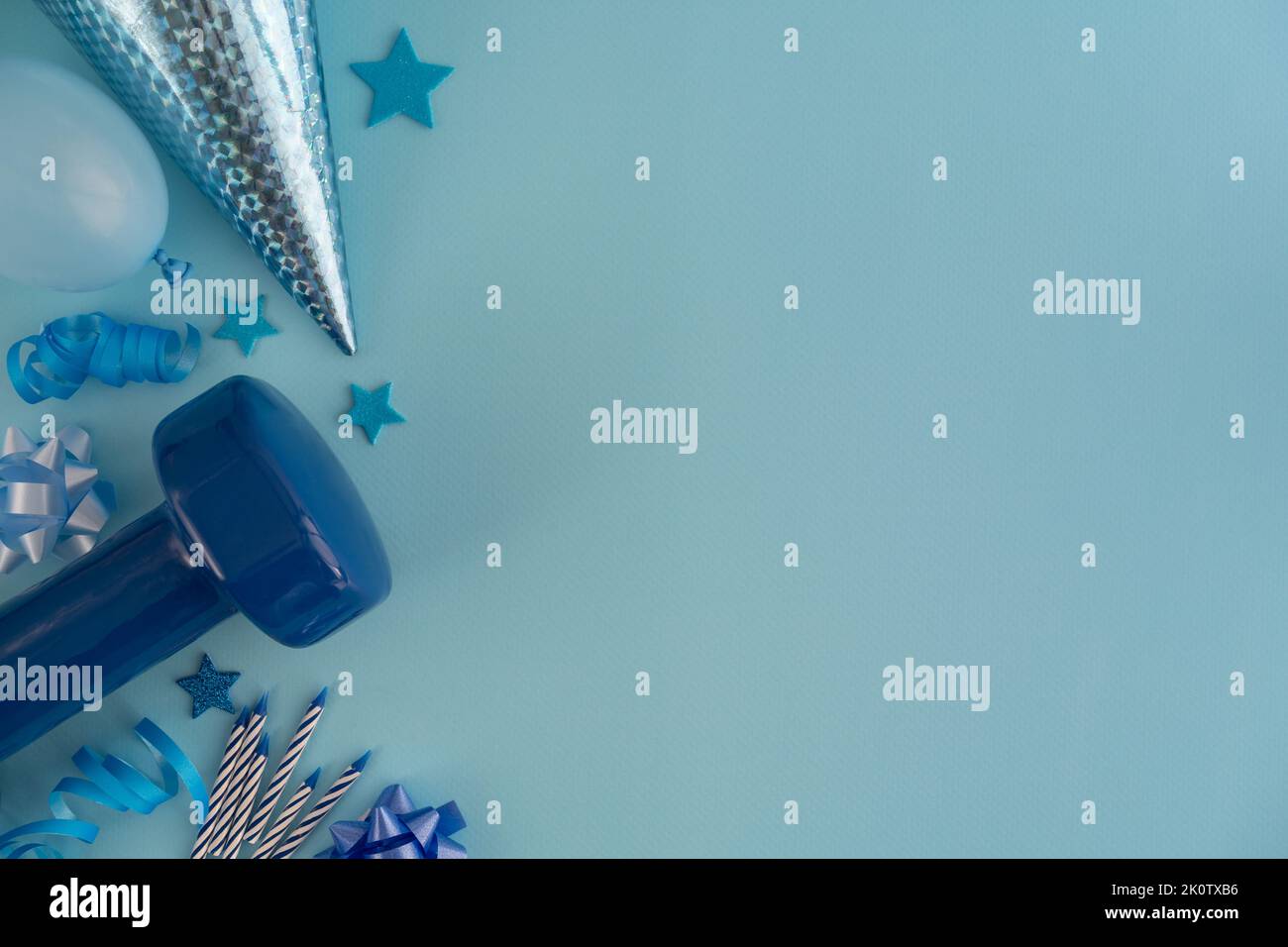 Dumbbell, birthday cake candles, party hat, balloon, ribbons and ...