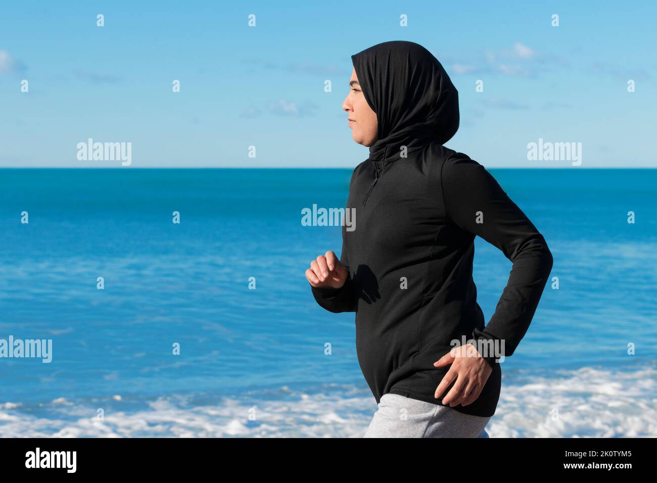 Muslim woman running outside hi-res stock photography and images - Alamy