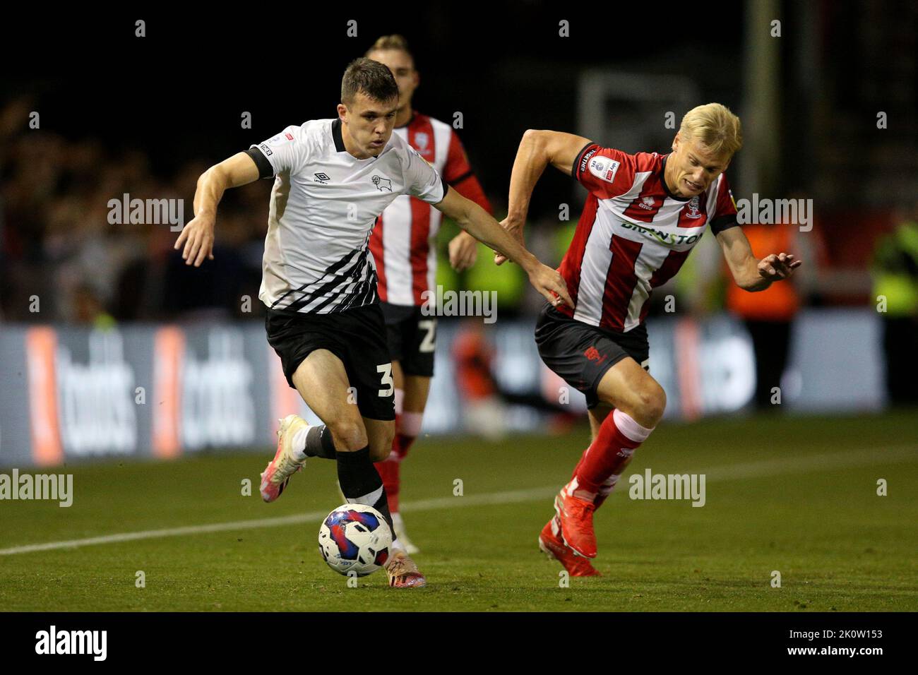 Derby County’s Jason Knight (left) and Lincoln City’s Lasse Sorensen in ...