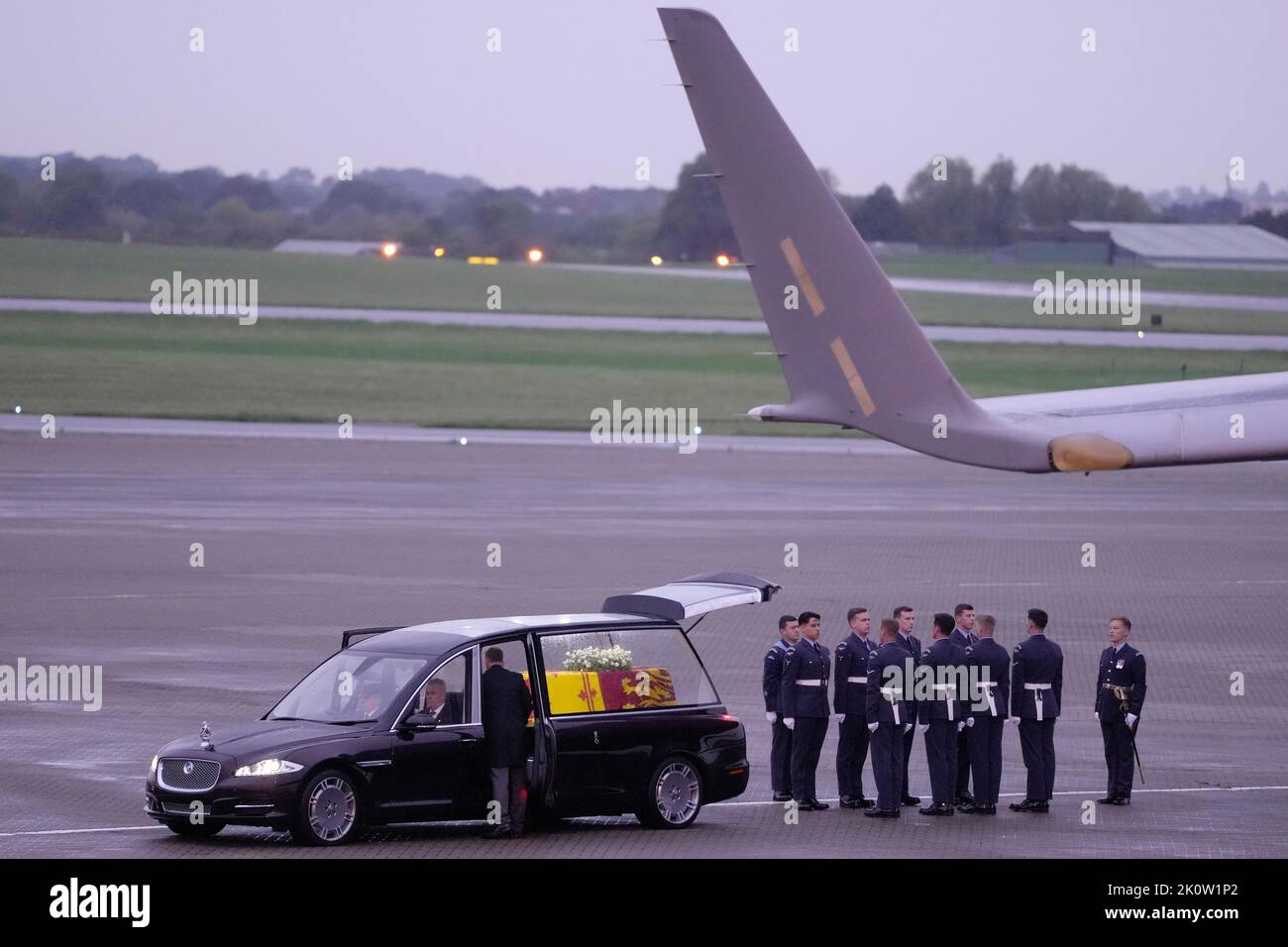 The coffin of Queen Elizabeth II is carried off a plane by the Queen's ...