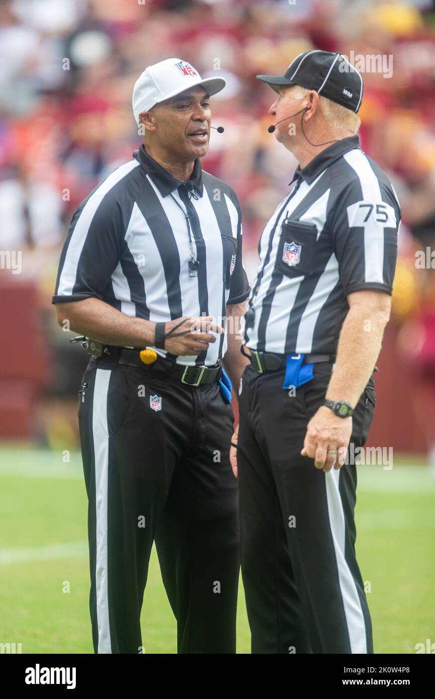 NFL referee Tra Blake (3) has a conversation with line judge Mark ...