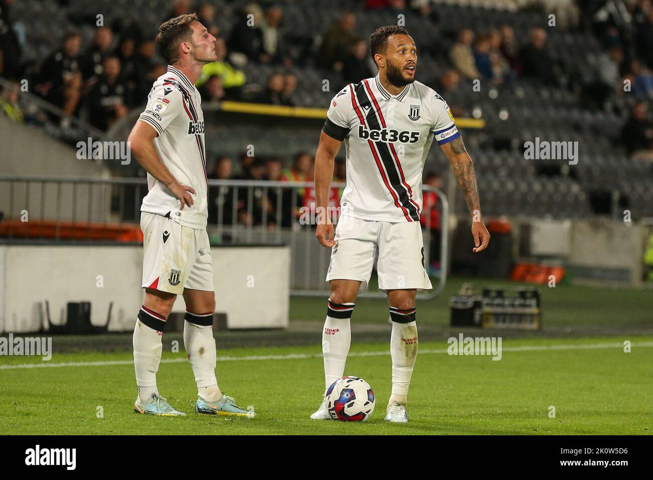Lewis Baker #8 and Jordan Thompson #15 of Stoke City over the free-kick ...