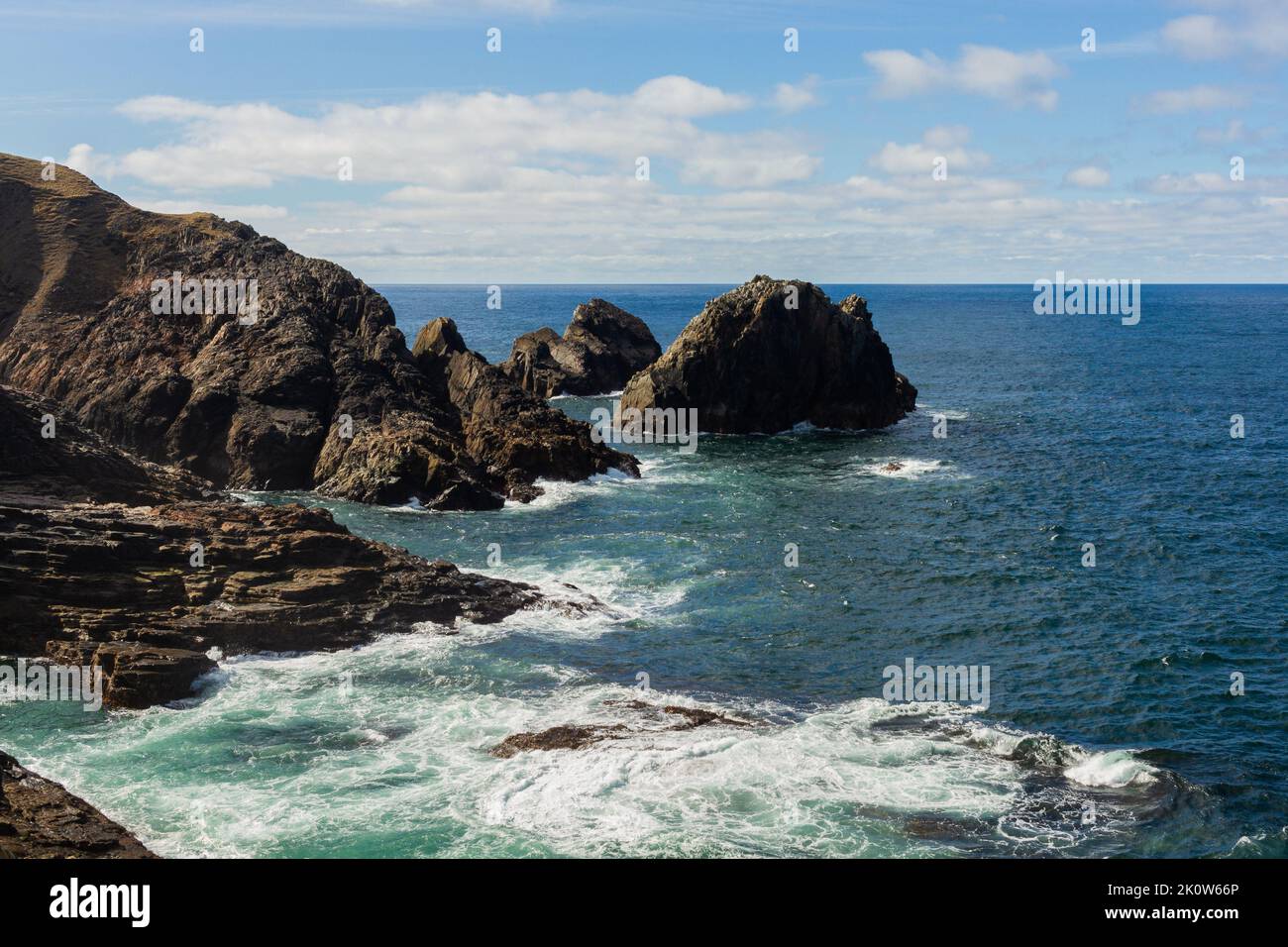 A view of the rocky cliff and the sea Stock Photo - Alamy