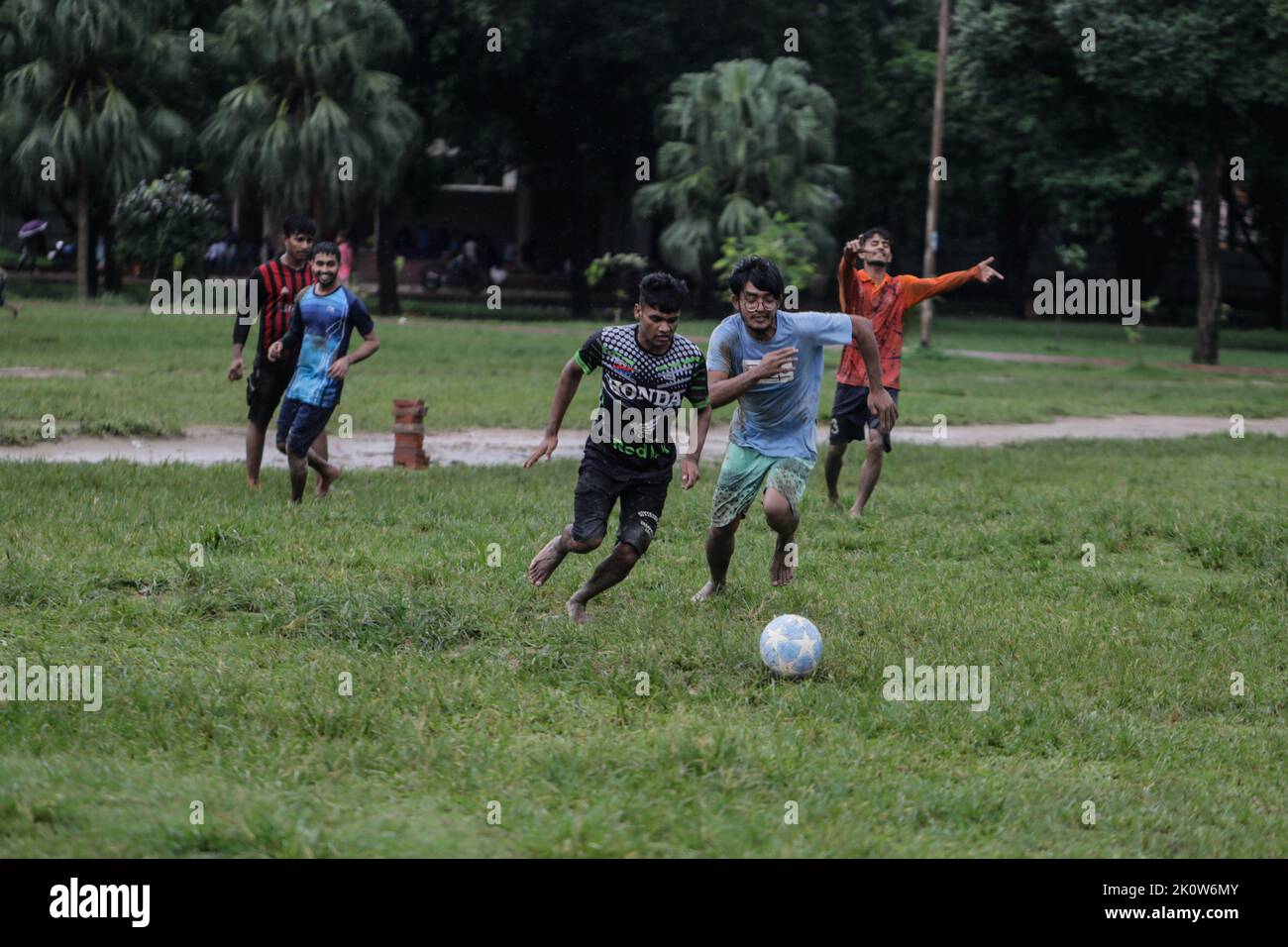 Dhaka, Bangladesh. 13th Sep, 2022. People are playing football at ...