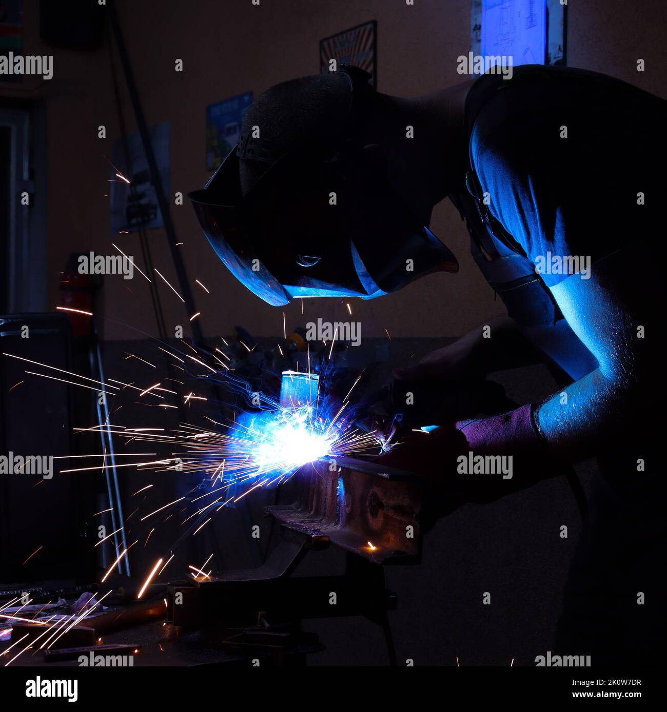 a man welding at a factory Stock Photo - Alamy