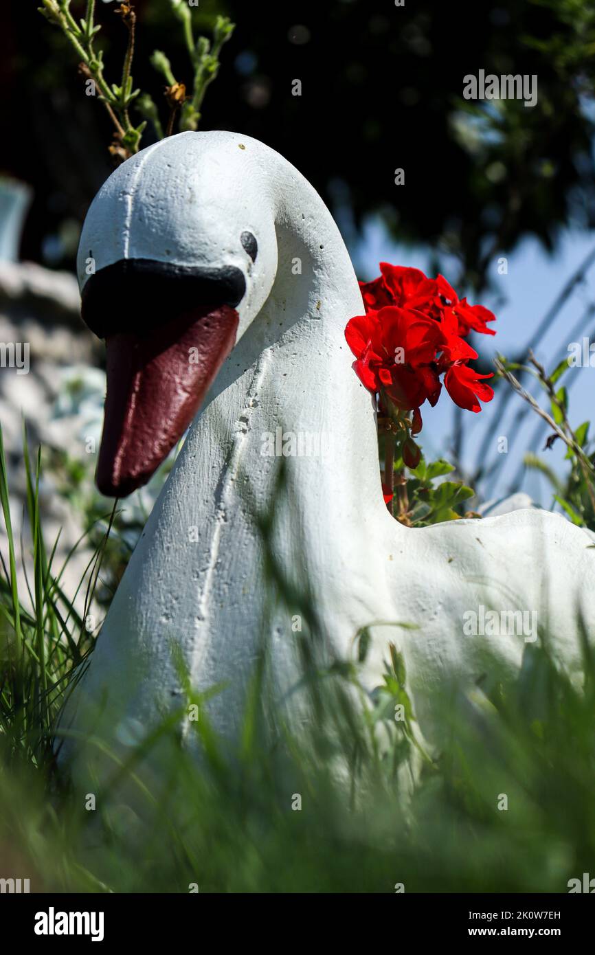 a swan statue on a grass Stock Photo - Alamy