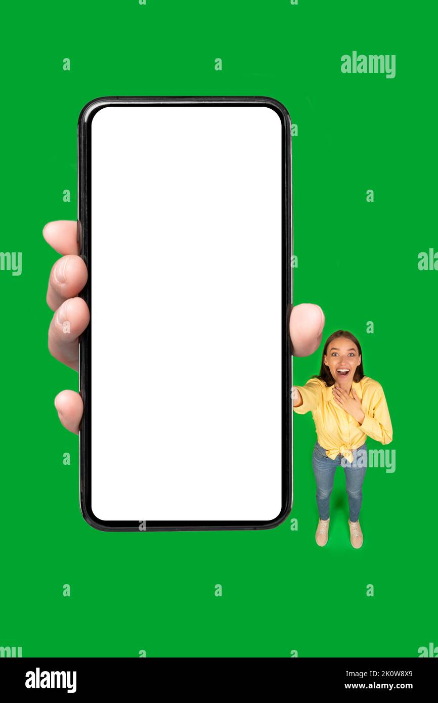 Lady showing huge smartphone hi-res stock photography and images - Alamy