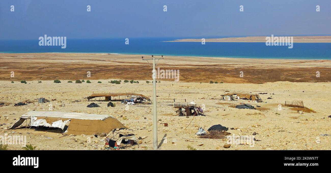 Village huts of a nomad camp in the desert near the sea in the Middle ...
