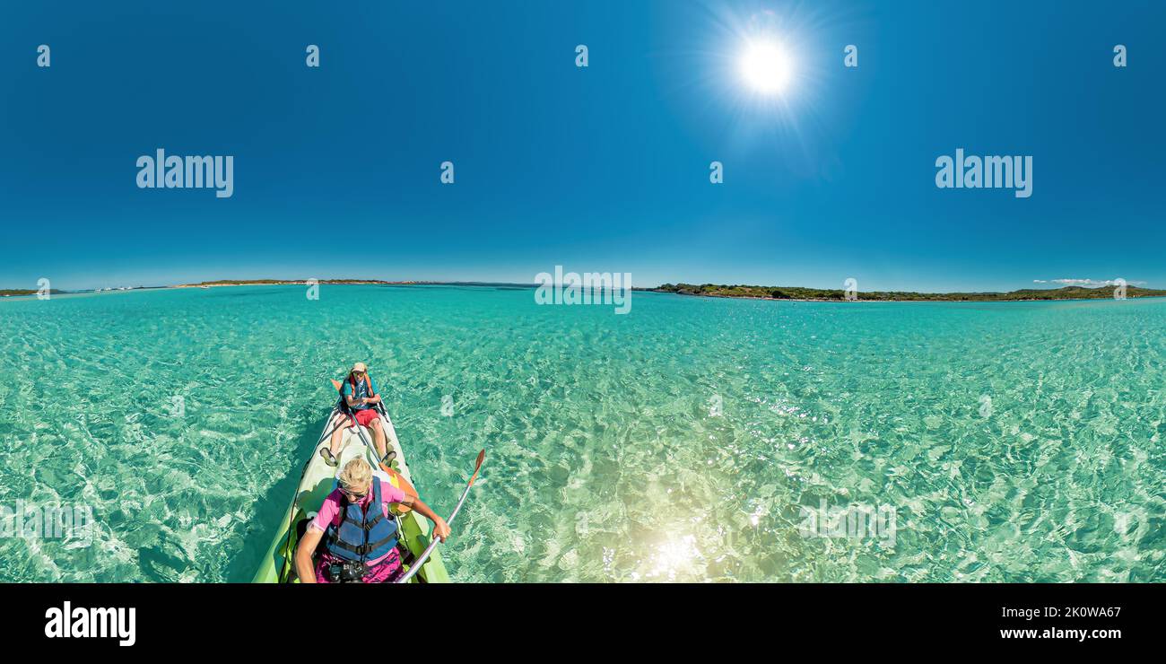 Drone view of people kayaking in the Mediterranean sea by Piana island ...