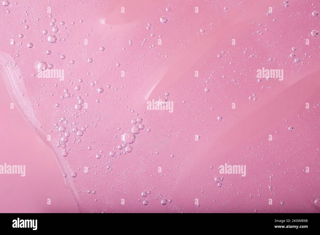 Macro photography of bubbly smear on raspberry pink background,large ...