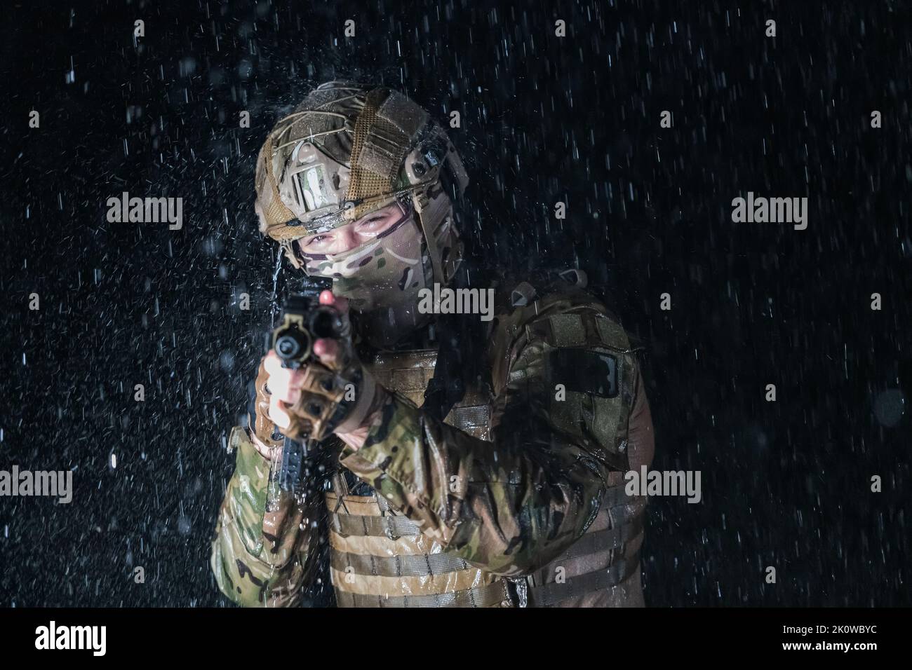 Army soldier in Combat Uniforms with an assault rifle, plate carrier ...