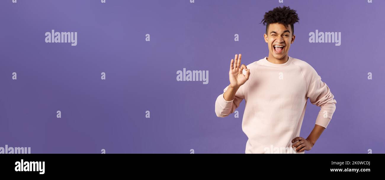 Portrait of enthusiastic young relaxed man show no problem, guarantee ...