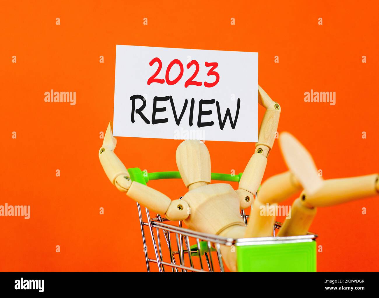2023 Review symbol. White paper with words 2023 Review, human model in ...
