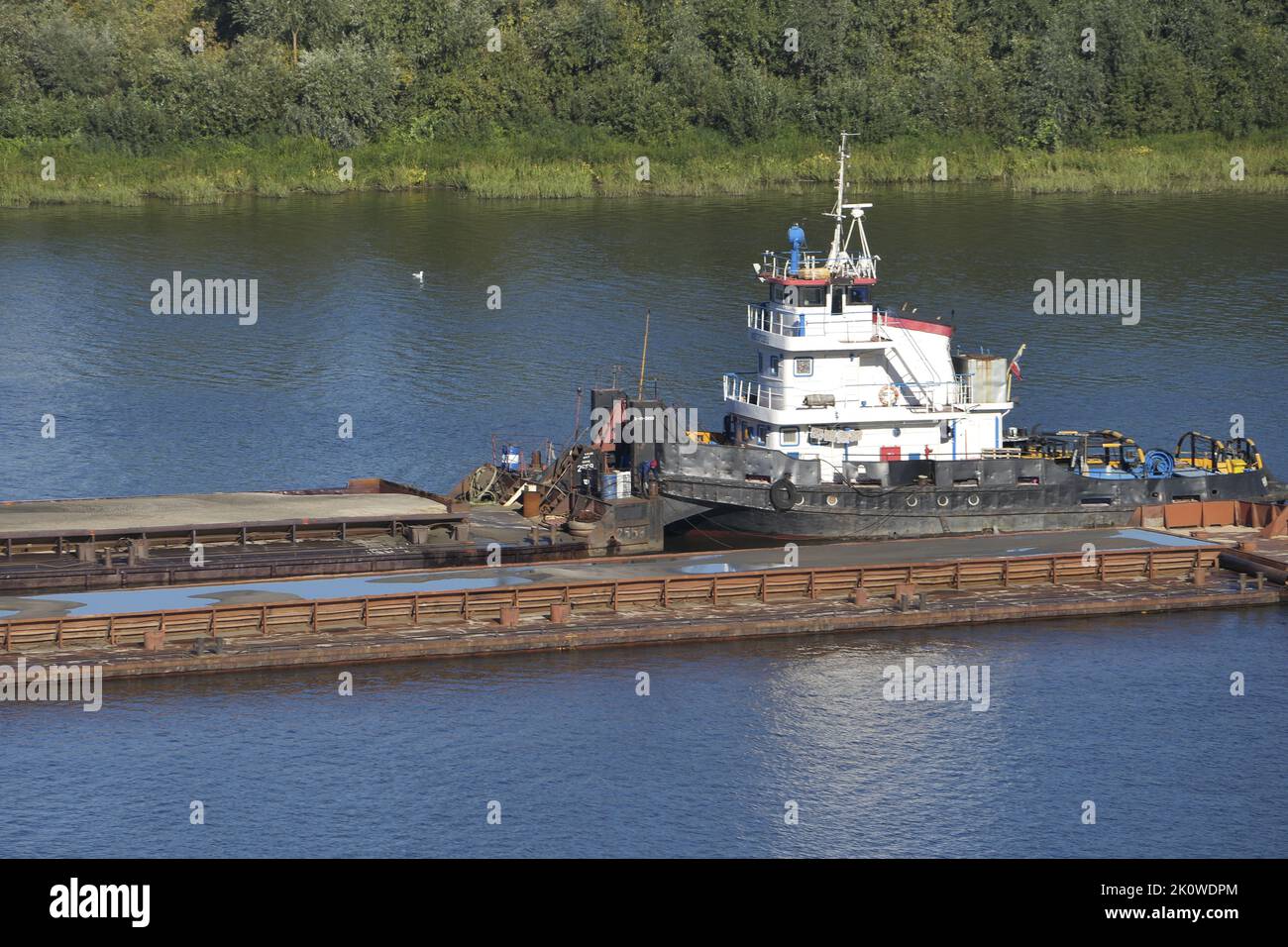 Water transport carrying goods along the river Stock Photo - Alamy