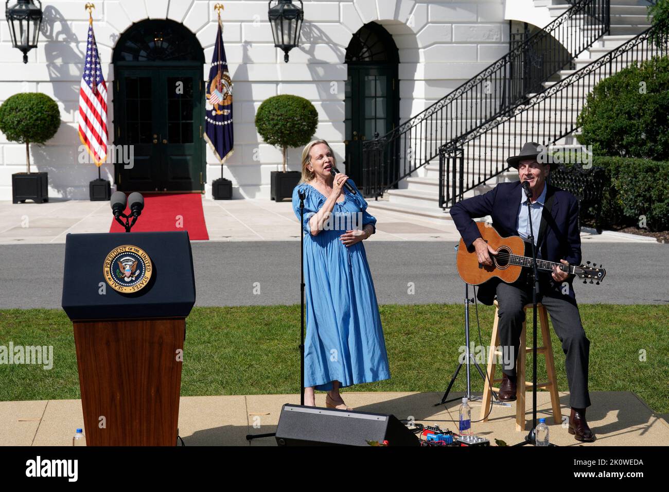 Musicians James Taylor and Kim Taylor perform at an event with ...