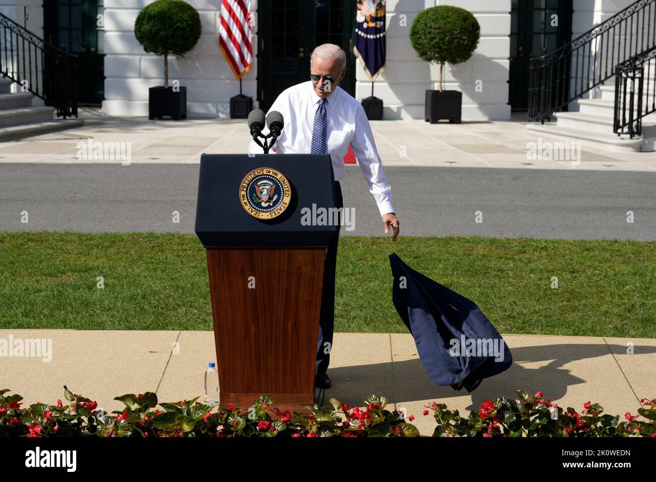 U.S. President Joe Biden drops his jacket at an event celebrating the ...