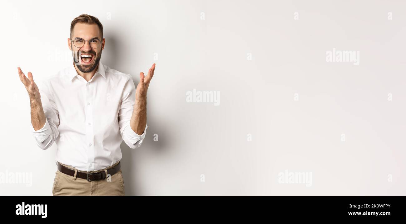 Frustrated and angry man screaming in rage, shaking hands furious ...