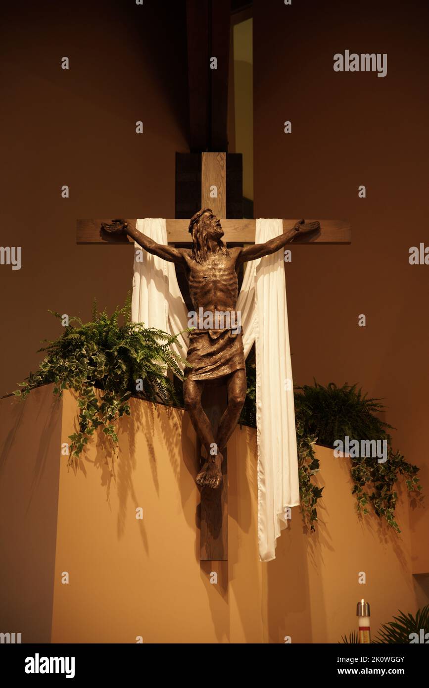 A crucifix figure inside a church,vertical shot Stock Photo - Alamy