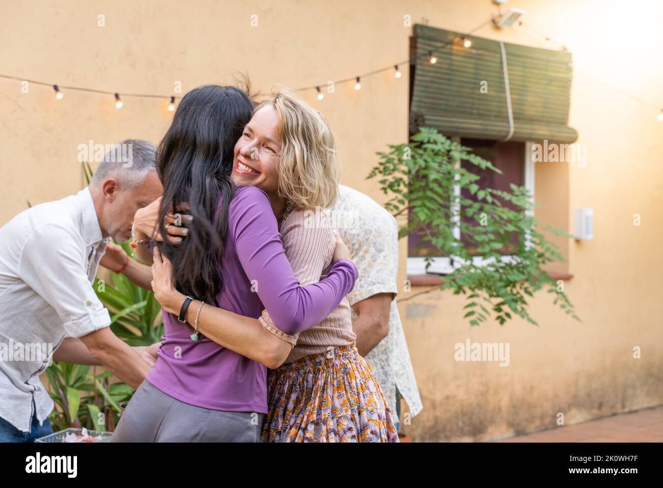 Two women huddle hi-res stock photography and images - Alamy