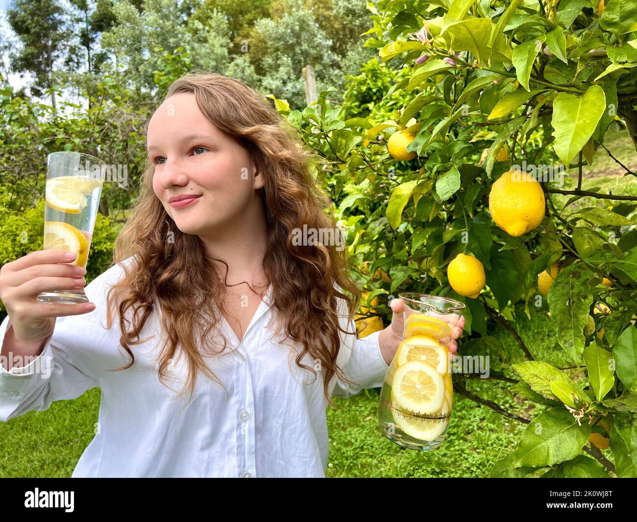 it's just a lemon paradise, a teenage girl stands against the backdrop ...