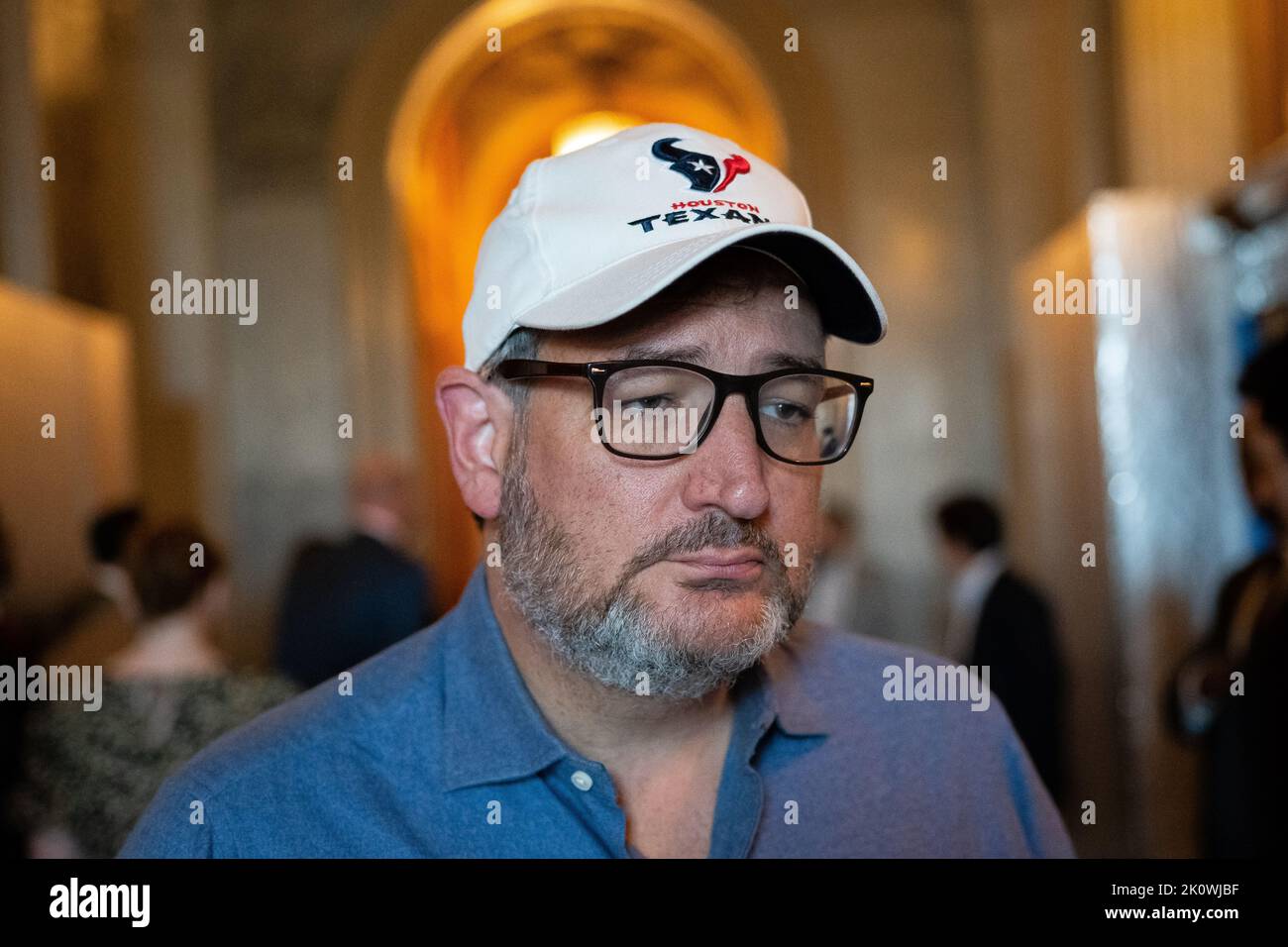 Senator Ted Cruz (R-TX) wearing a Houston Texans hat speaks with ...