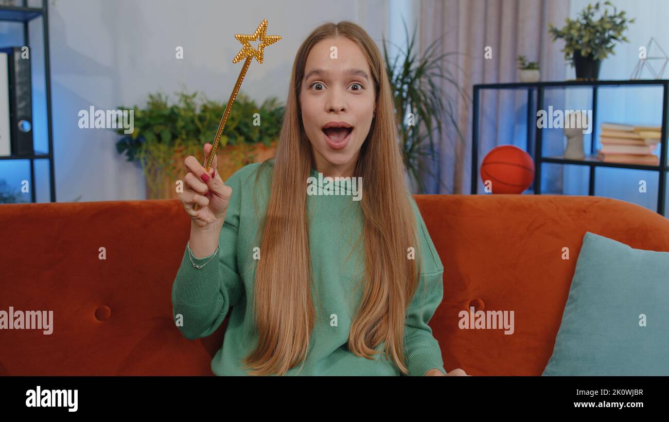 Portrait of student girl child kid magician wizard gesturing with magic ...