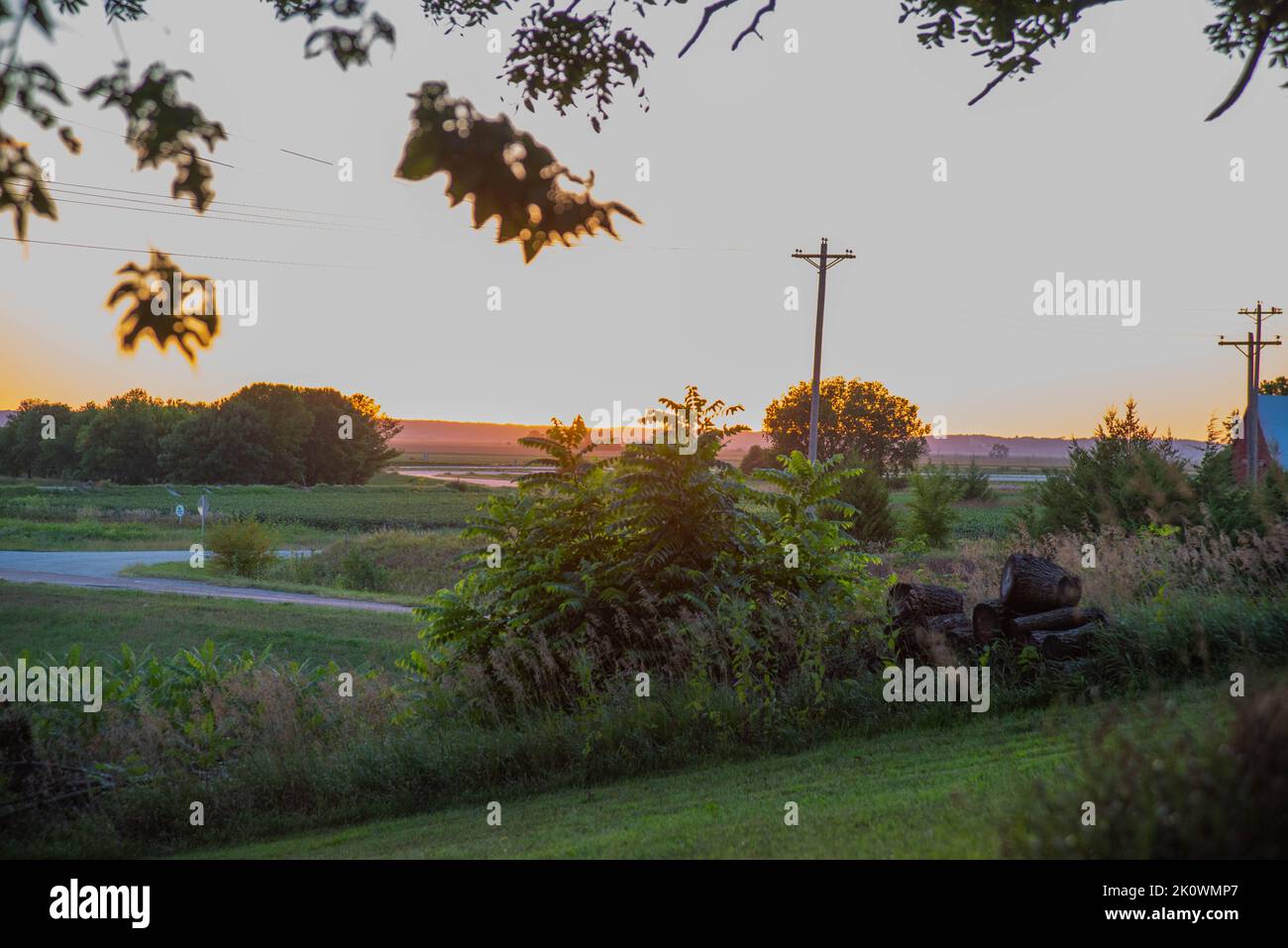 An image of the sunset on a farm Stock Photo - Alamy