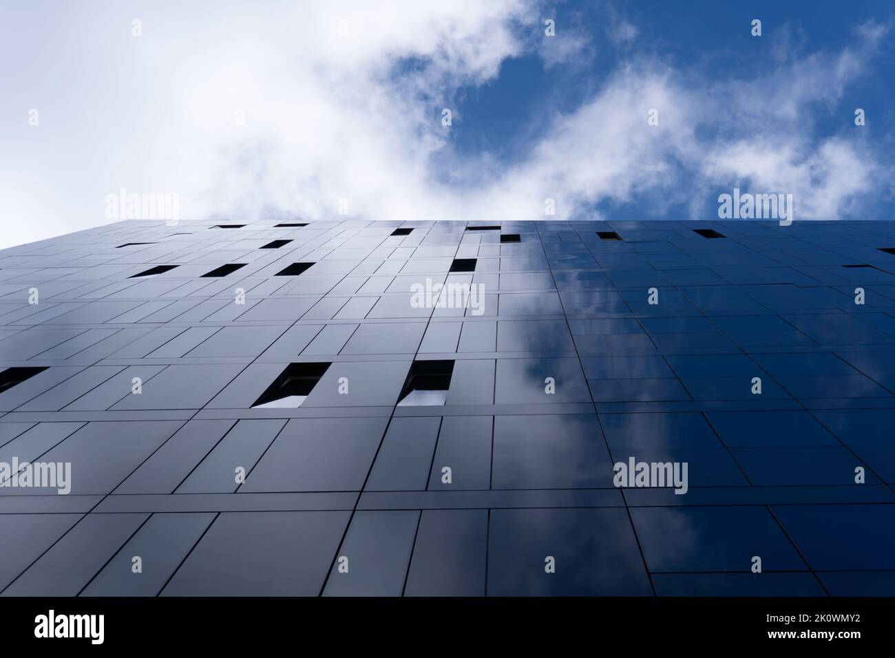A low-angle view of a modern building with reflective windows Stock ...