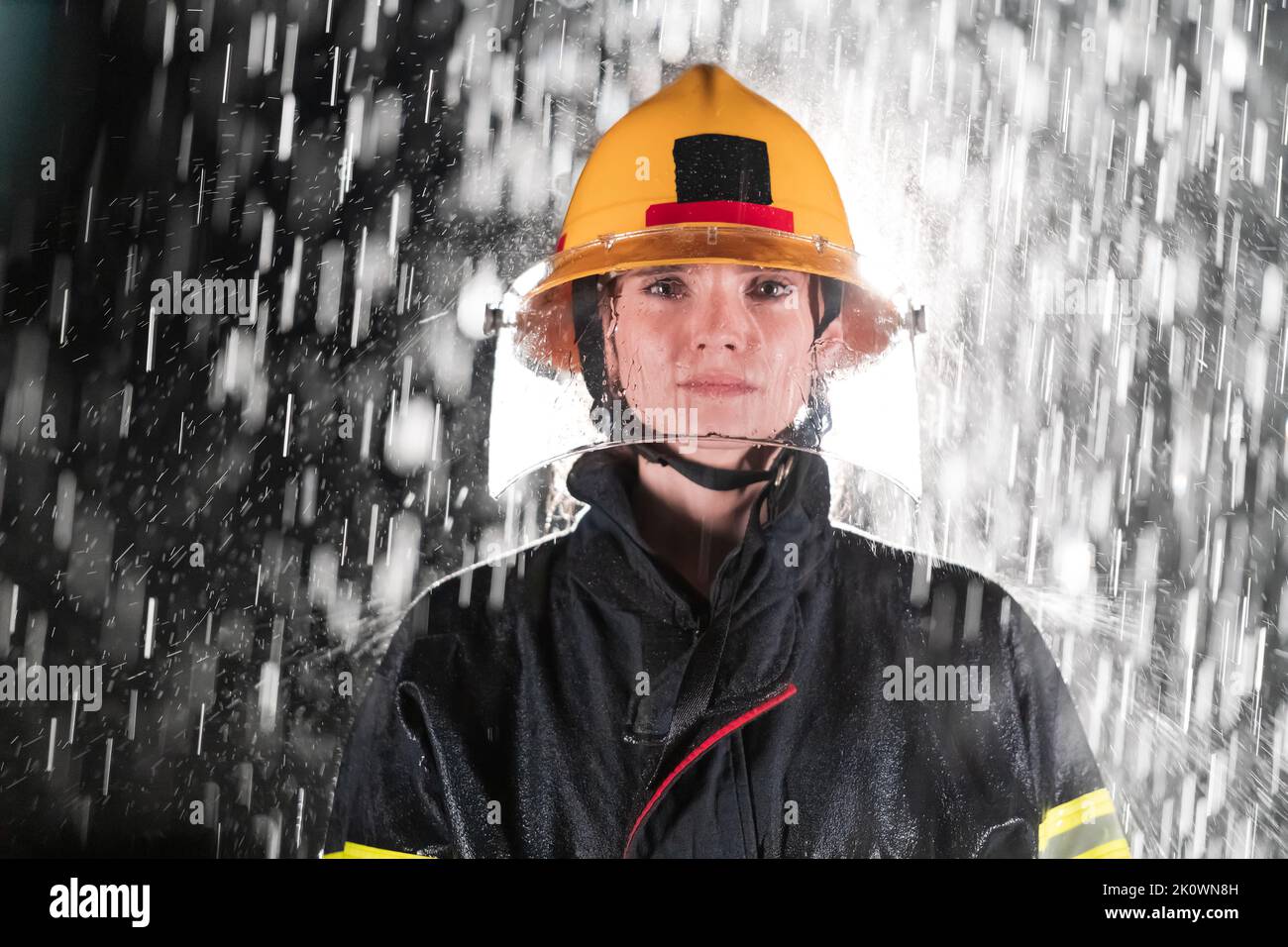 Portrait of a female firefighter standing and walking brave and ...