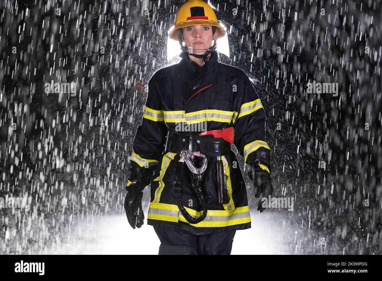 Portrait of a female firefighter standing and walking brave and ...