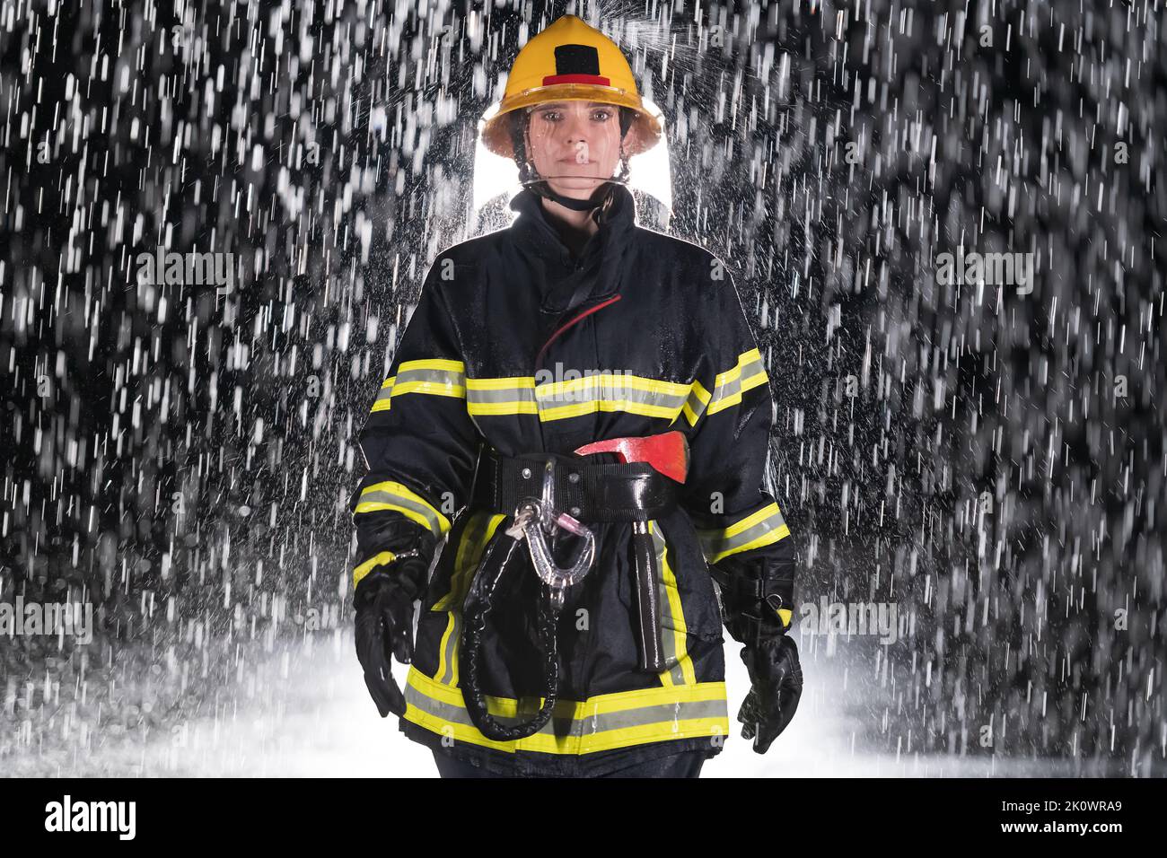 Portrait of a female firefighter standing and walking brave and ...