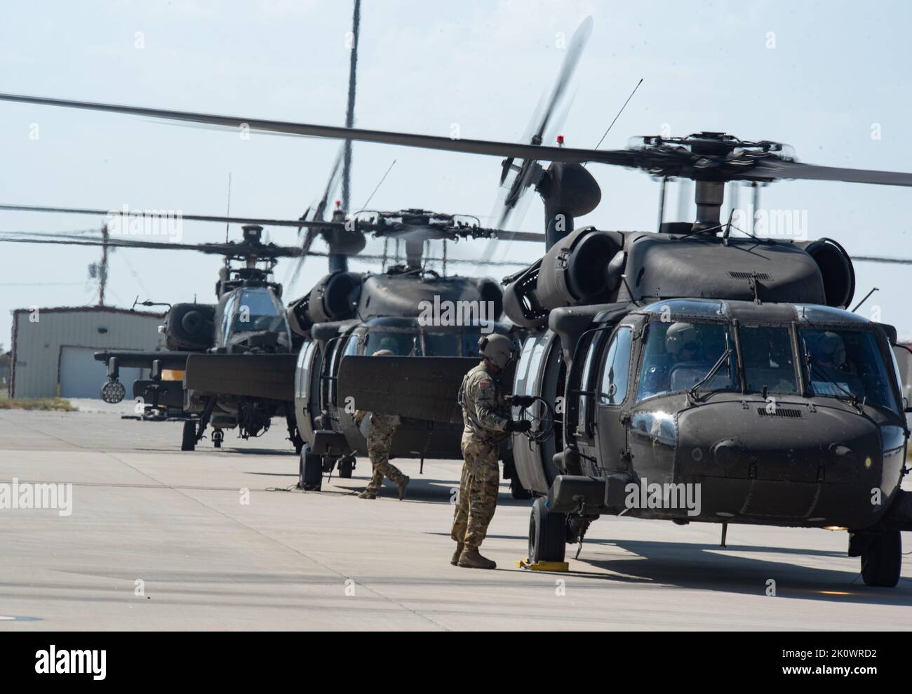 Utah Army National Guard UH-60 Black hawks and an Apache AH-64 depart ...