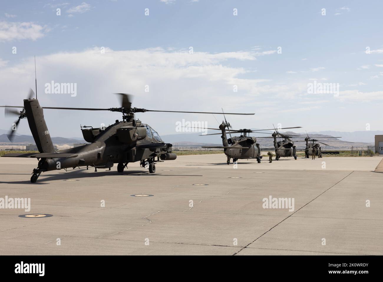 Utah Army National Guard UH-60 Black hawks and an Apache AH-64 depart ...