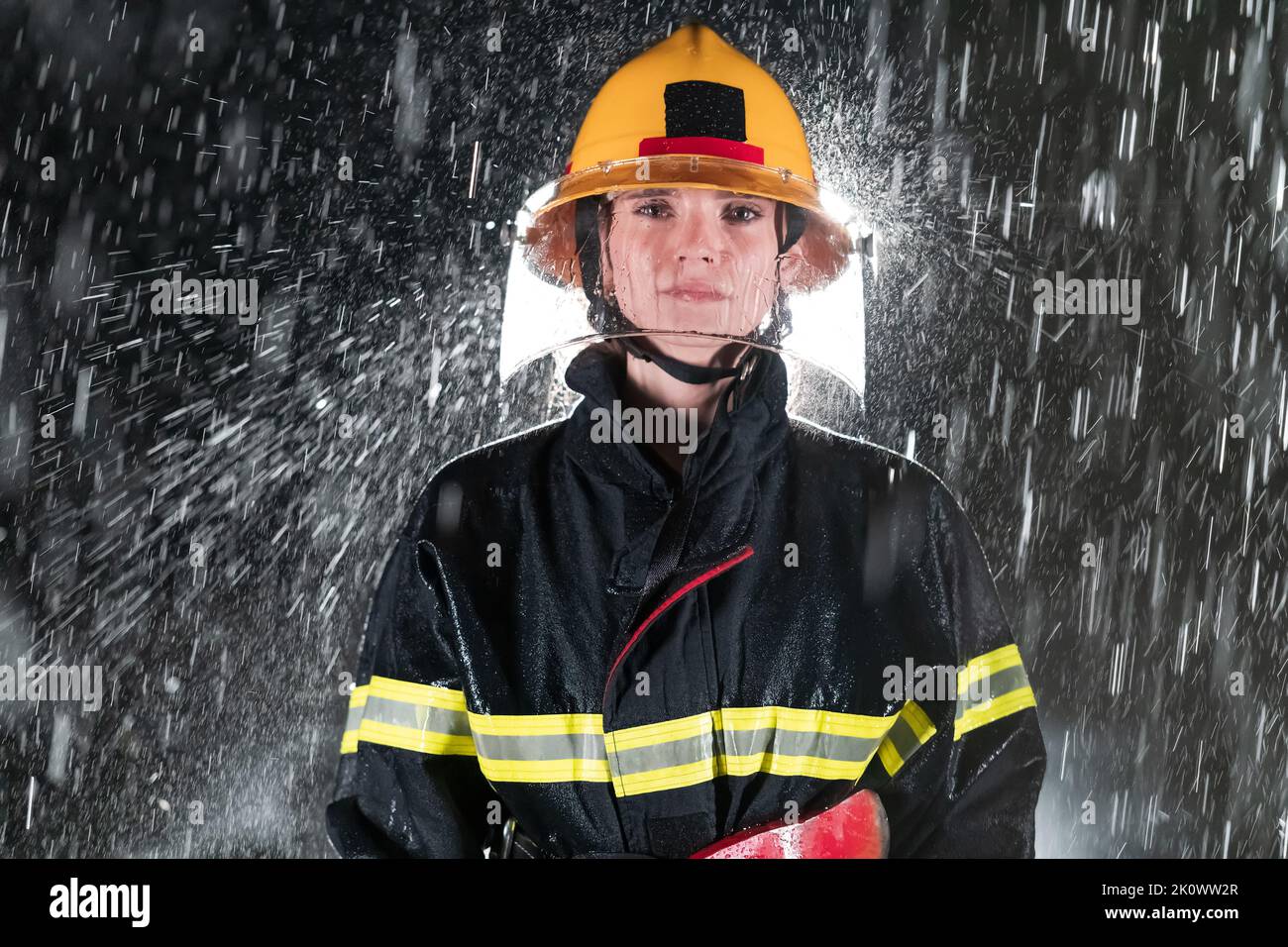 Portrait of a female firefighter standing and walking brave and ...