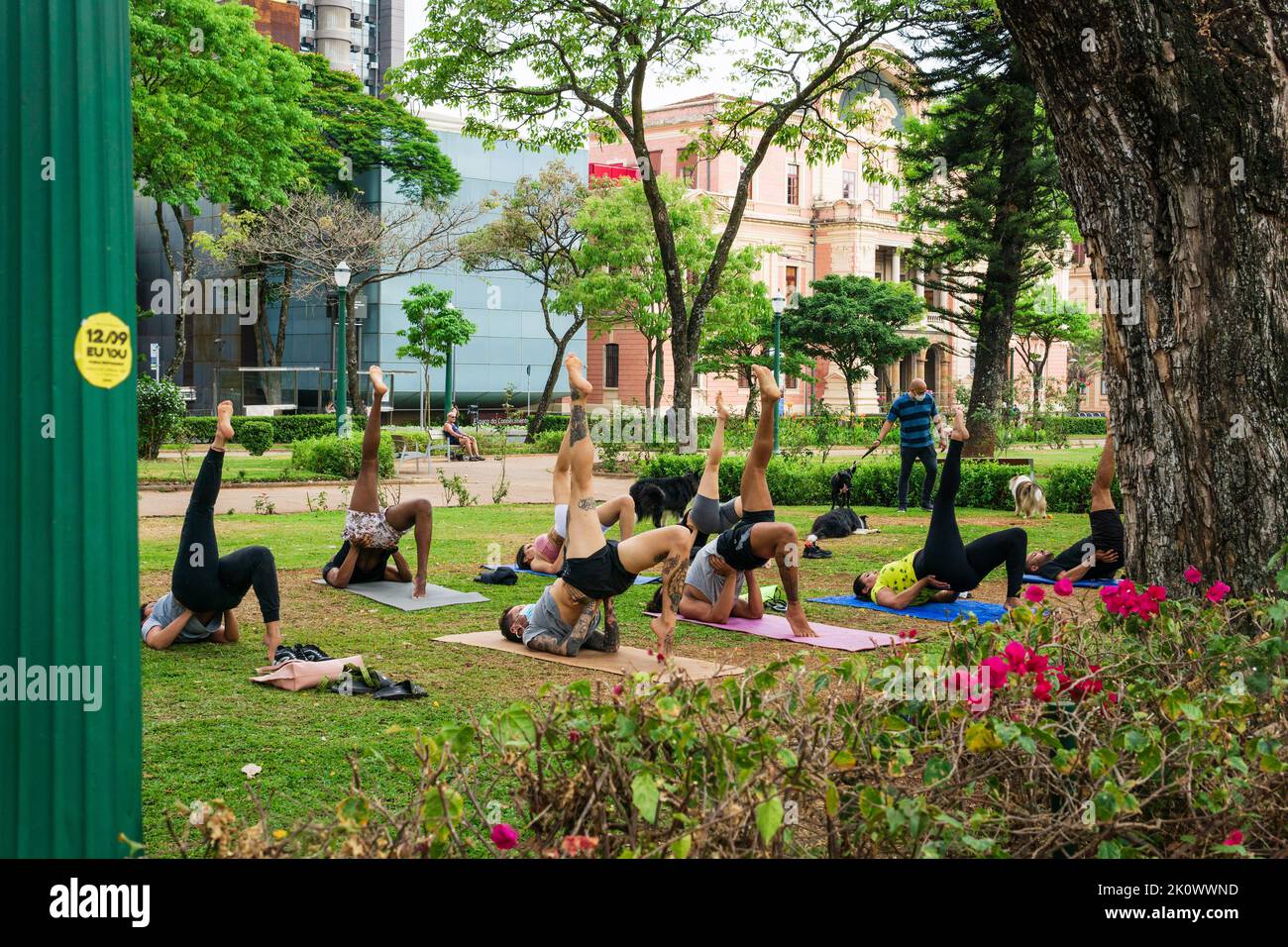 Group people relaxing doing yoga hi-res stock photography and images ...