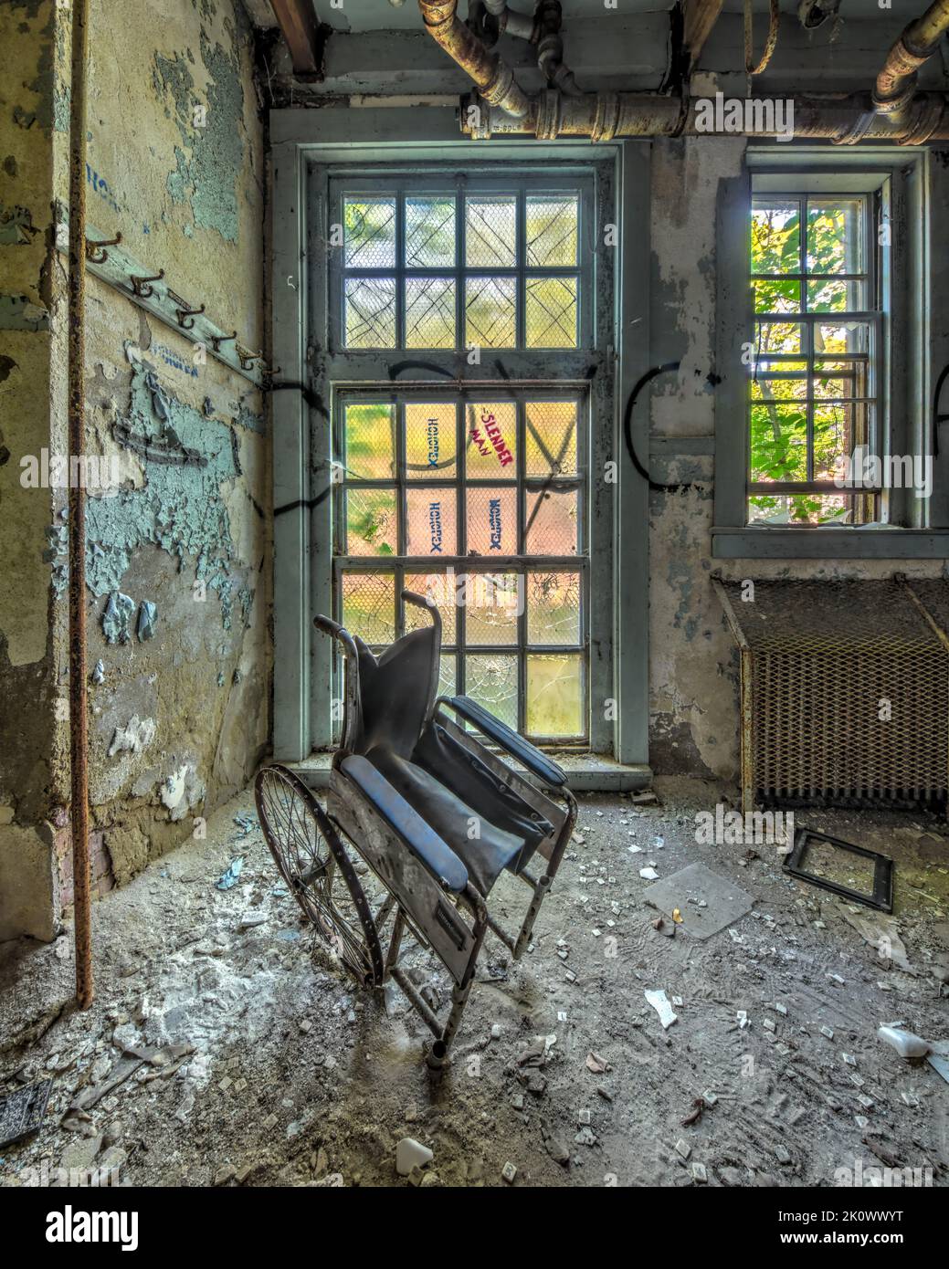 broken wheelchair abandoned hospital Stock Photo - Alamy