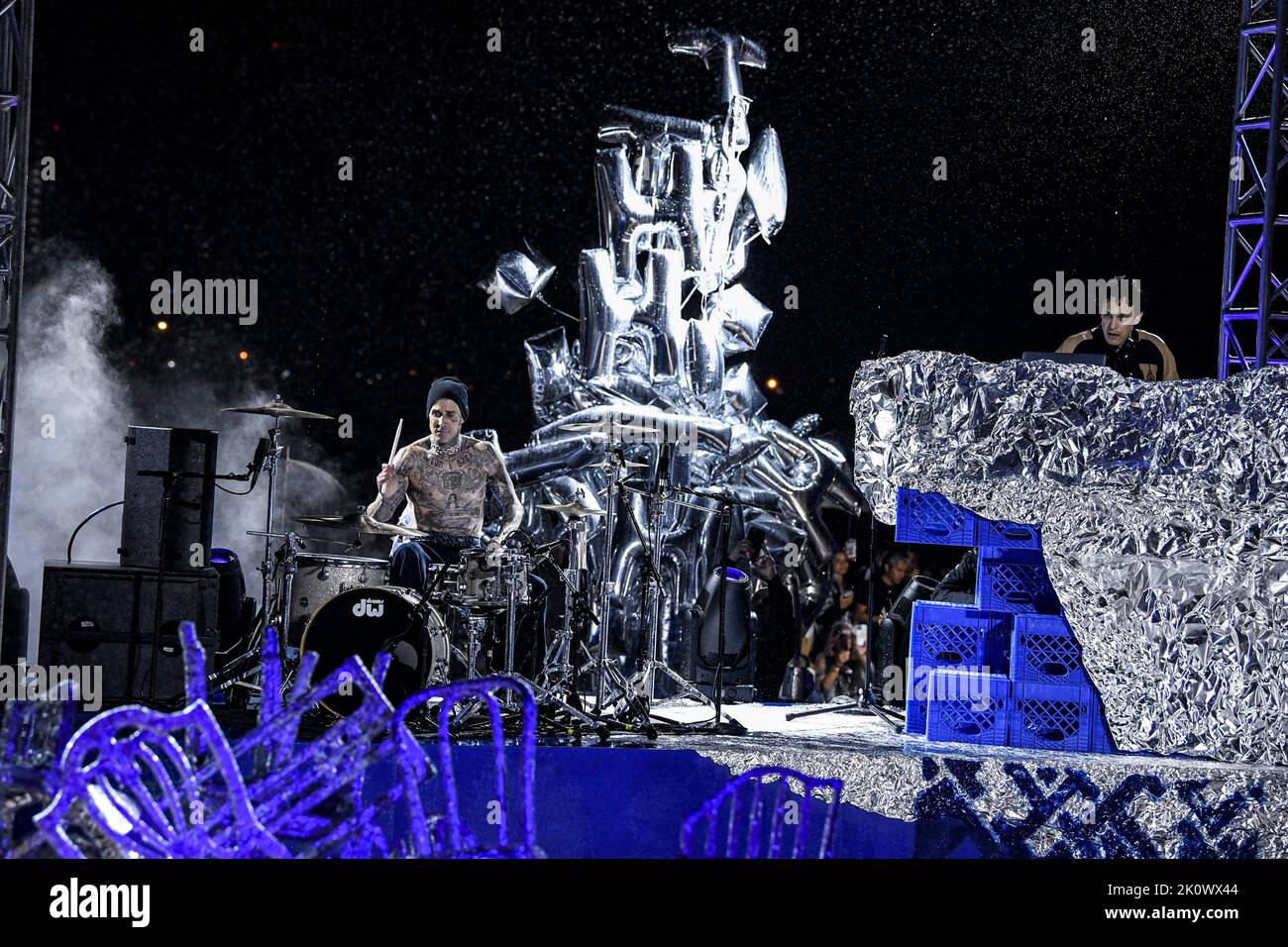 Travis Barker performs on the runway at the Tommy Hilfiger fashion show ...