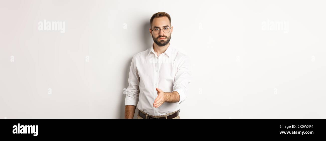 Confident businessman stretch hand for handshake, greeting business ...