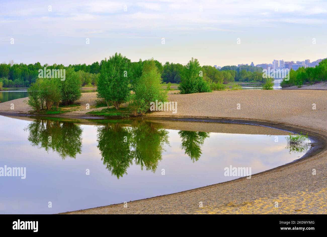 Sand spit on the Ob river. A deserted beach in the morning on the ...
