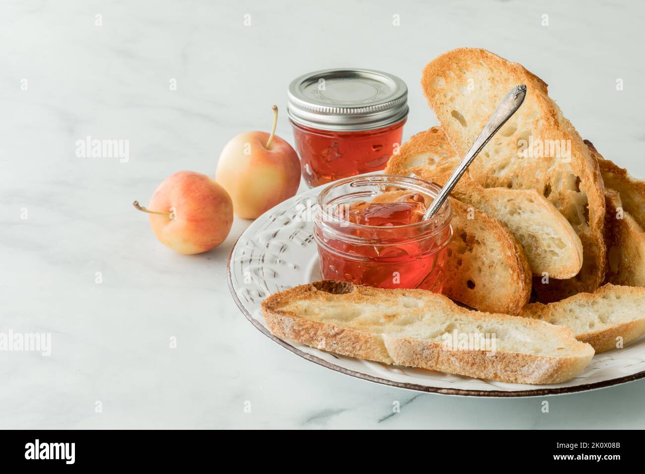 A plate of sourdough toasted bread served with crab apple jelly Stock ...