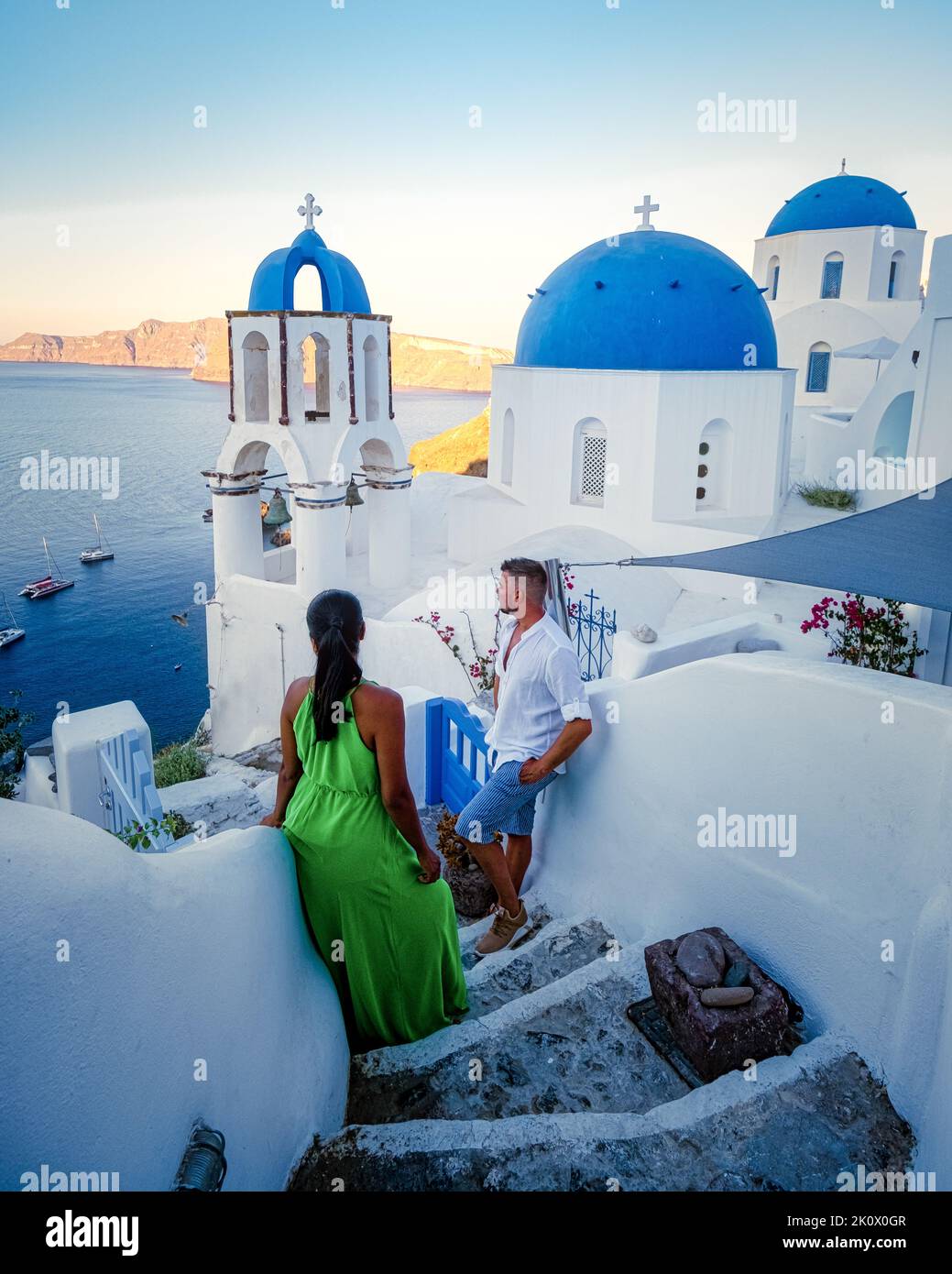 On vacation in Santorini Greece, two men and women visit Oia Santorini ...