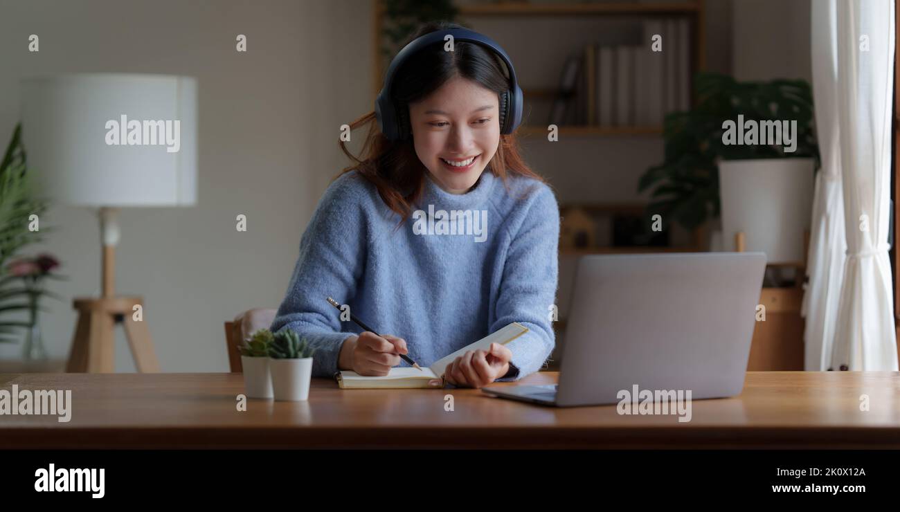 Young college student have question and answer to teacher by video call ...