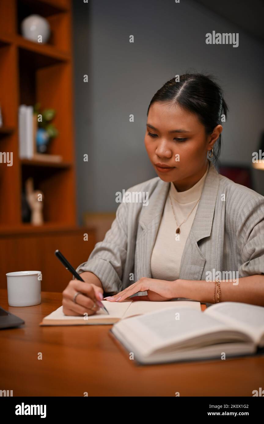 Portrait, Professional Asian businesswoman concentrating on her work ...