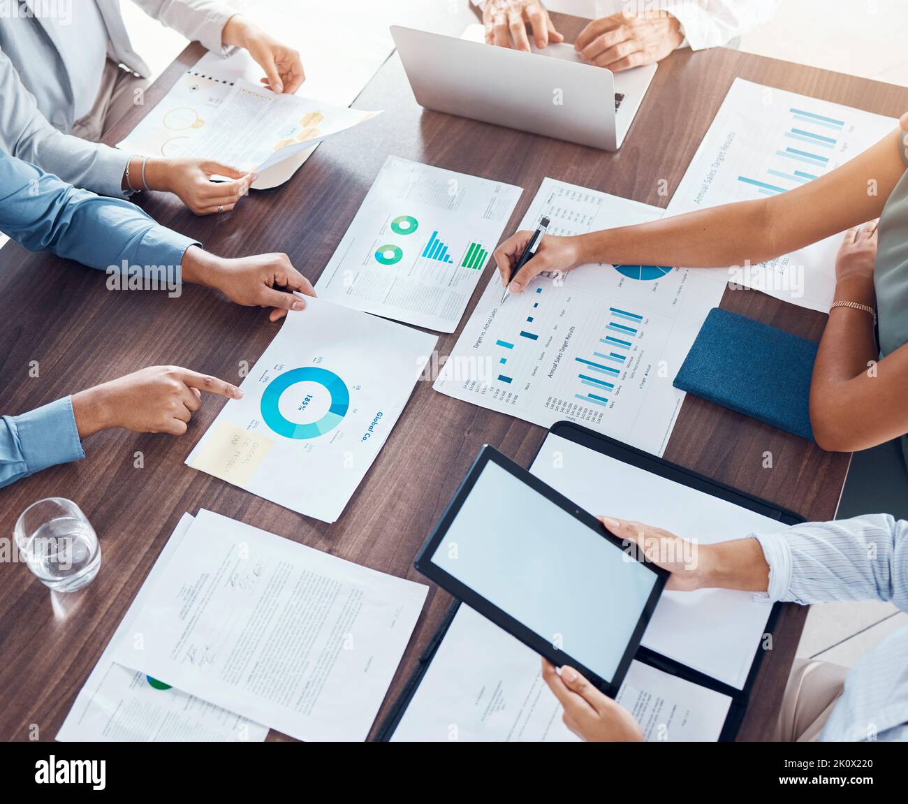 Business table, analytics documents and meeting in boardroom for ...