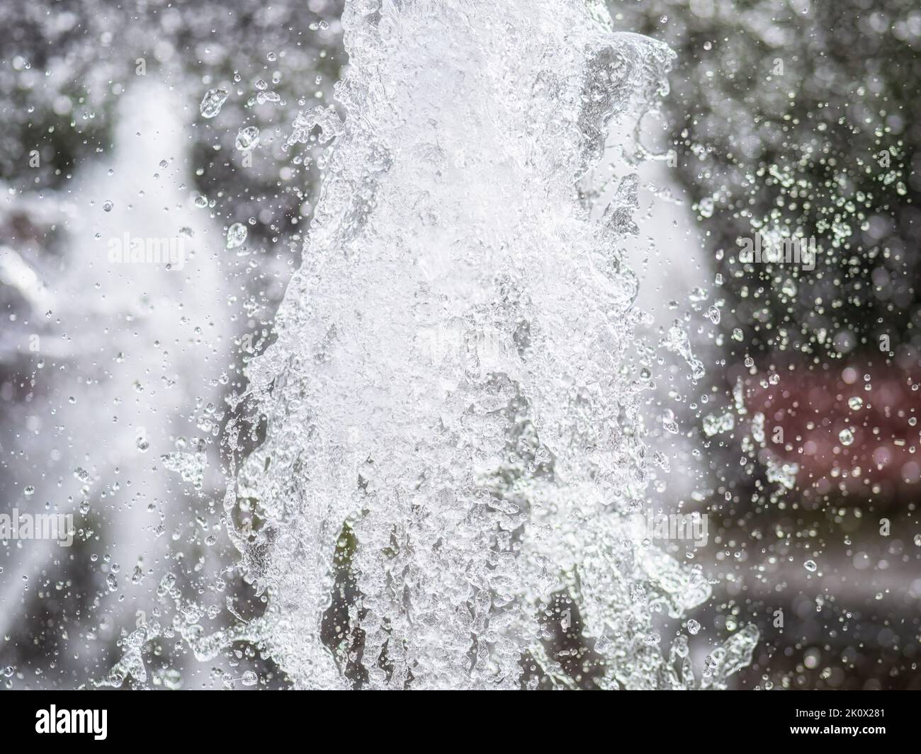 Water splashes from fountain on dark background. Natural texture of ...