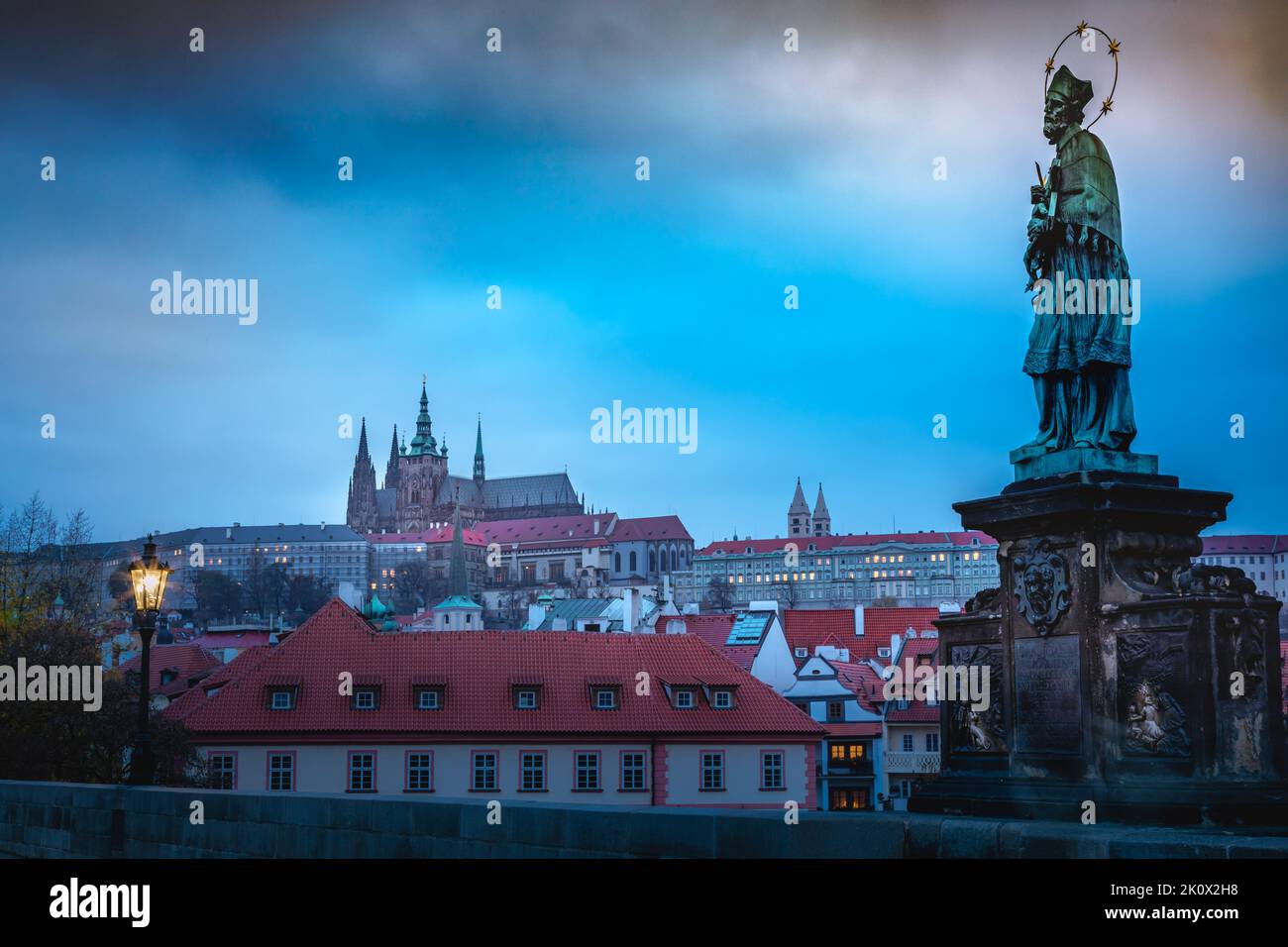 Charles bridge illuminated at dawn, Medieval Prague, Czech Republic ...