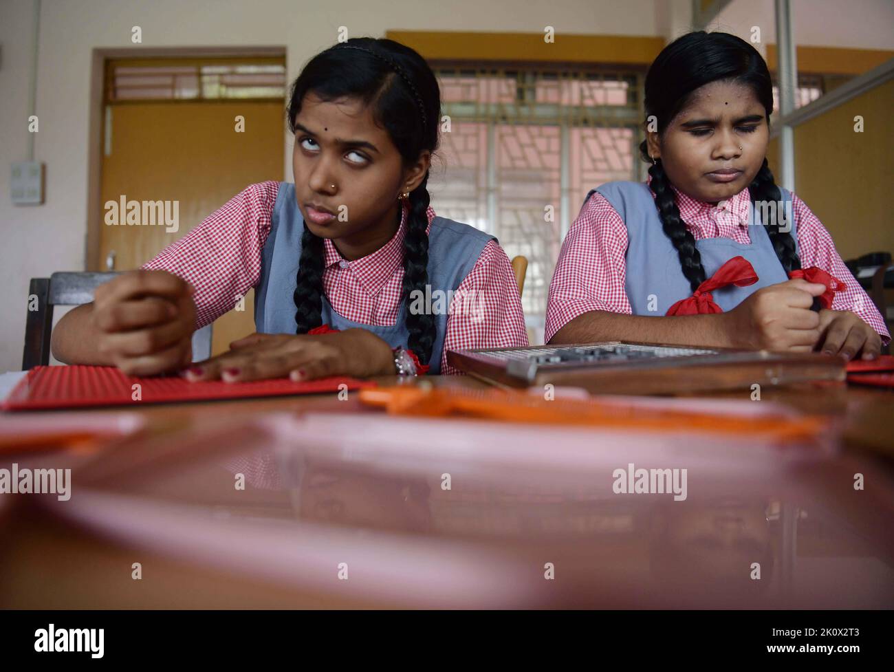 Visually impaired students studying during a special class on the eve ...