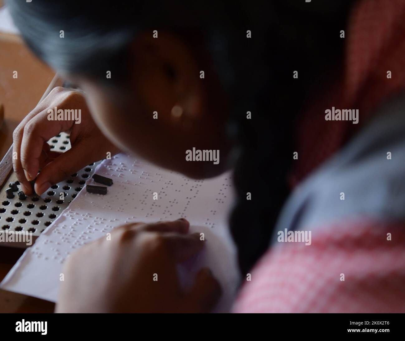 Visually impaired students studying during a special class on the eve ...